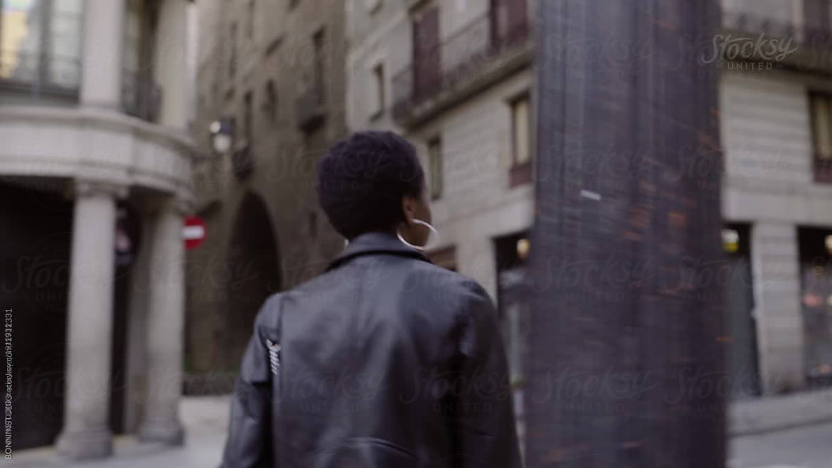 "Back View Of A Cool Woman Walking On The Street." by Stocksy ...