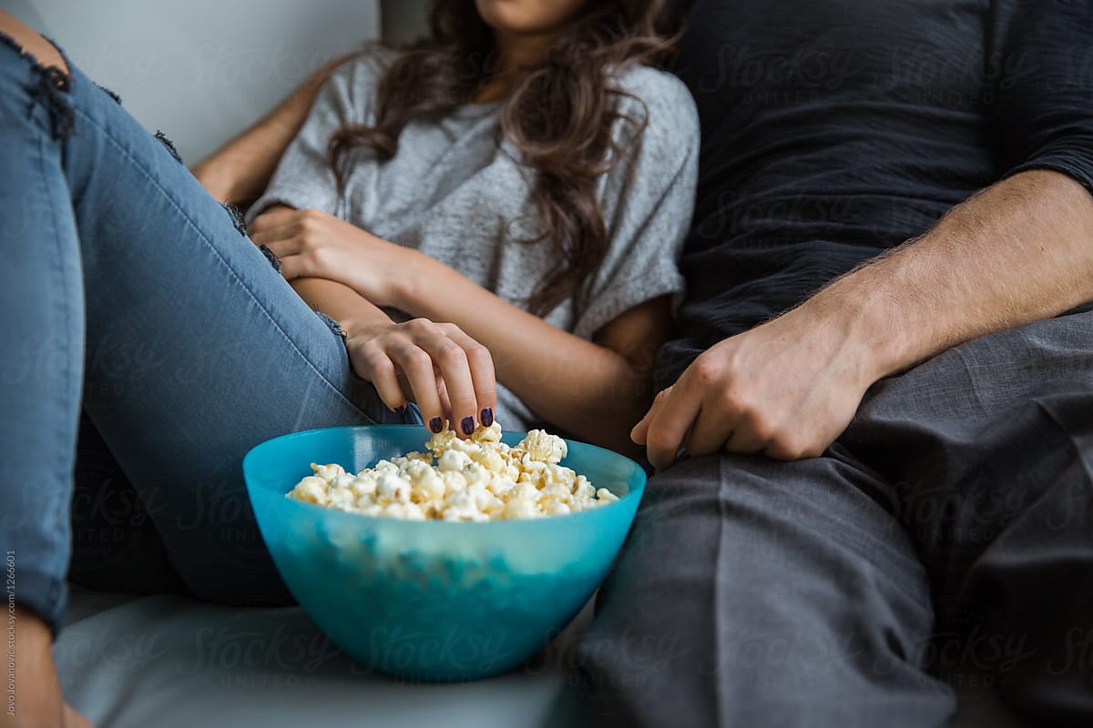 "Bowl Of Popcorn In Front Of Couple" by Stocksy Contributor "Jovo ...