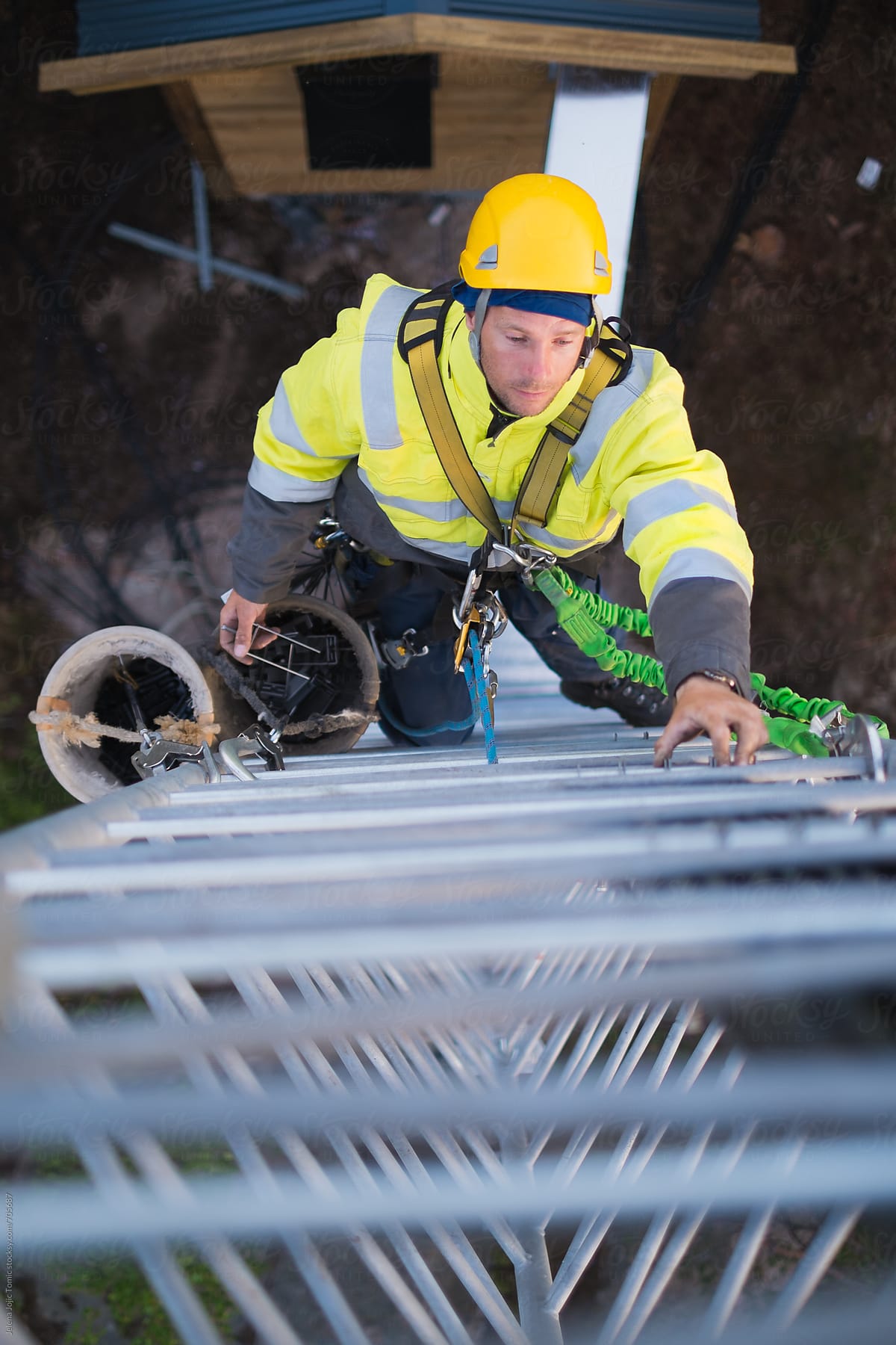 "Working At Heights, Technician Climbs Up On A Communications Tower" by ...