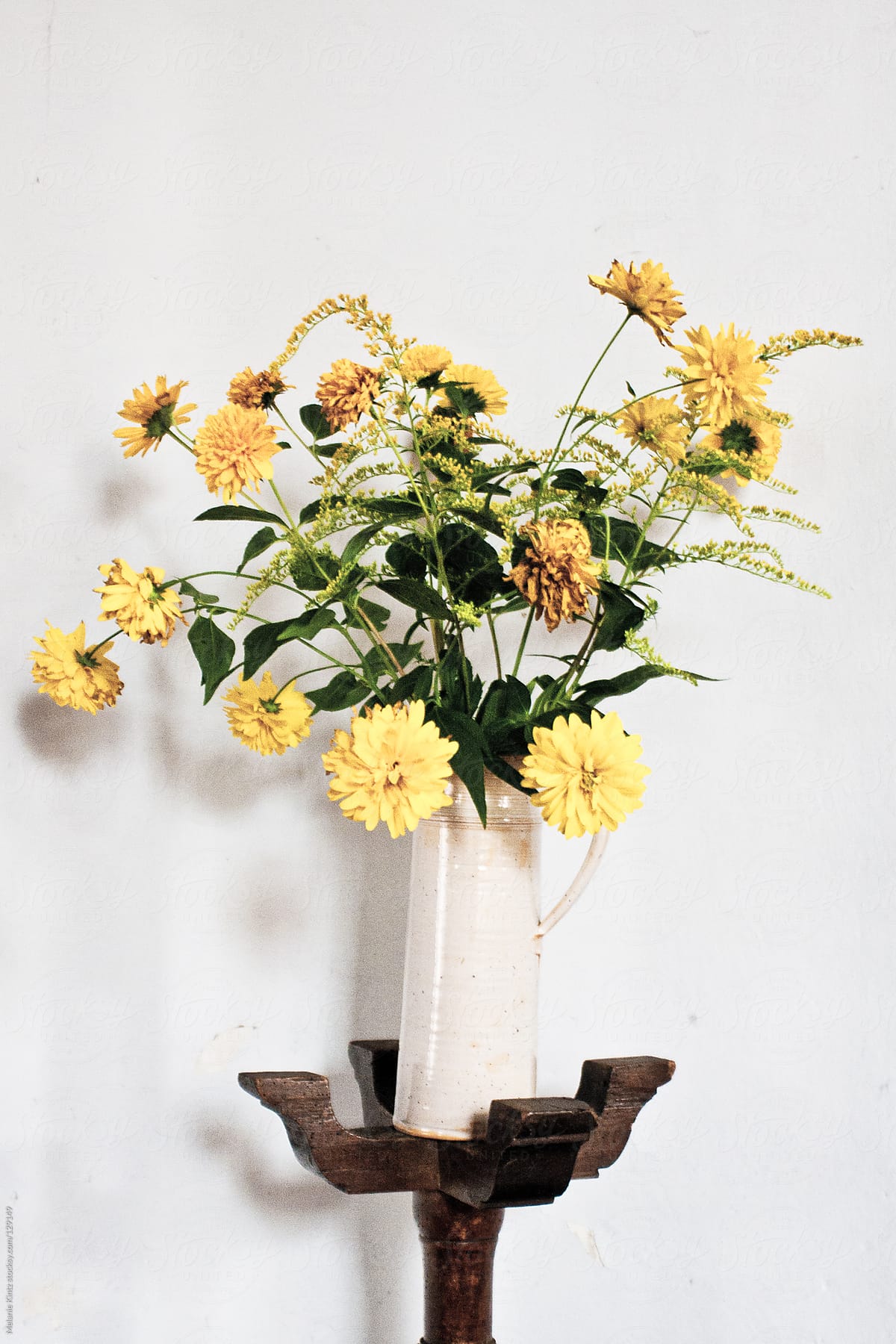 "Wilting Yellow Flowers In A Vase" by Stocksy Contributor "Melanie ...