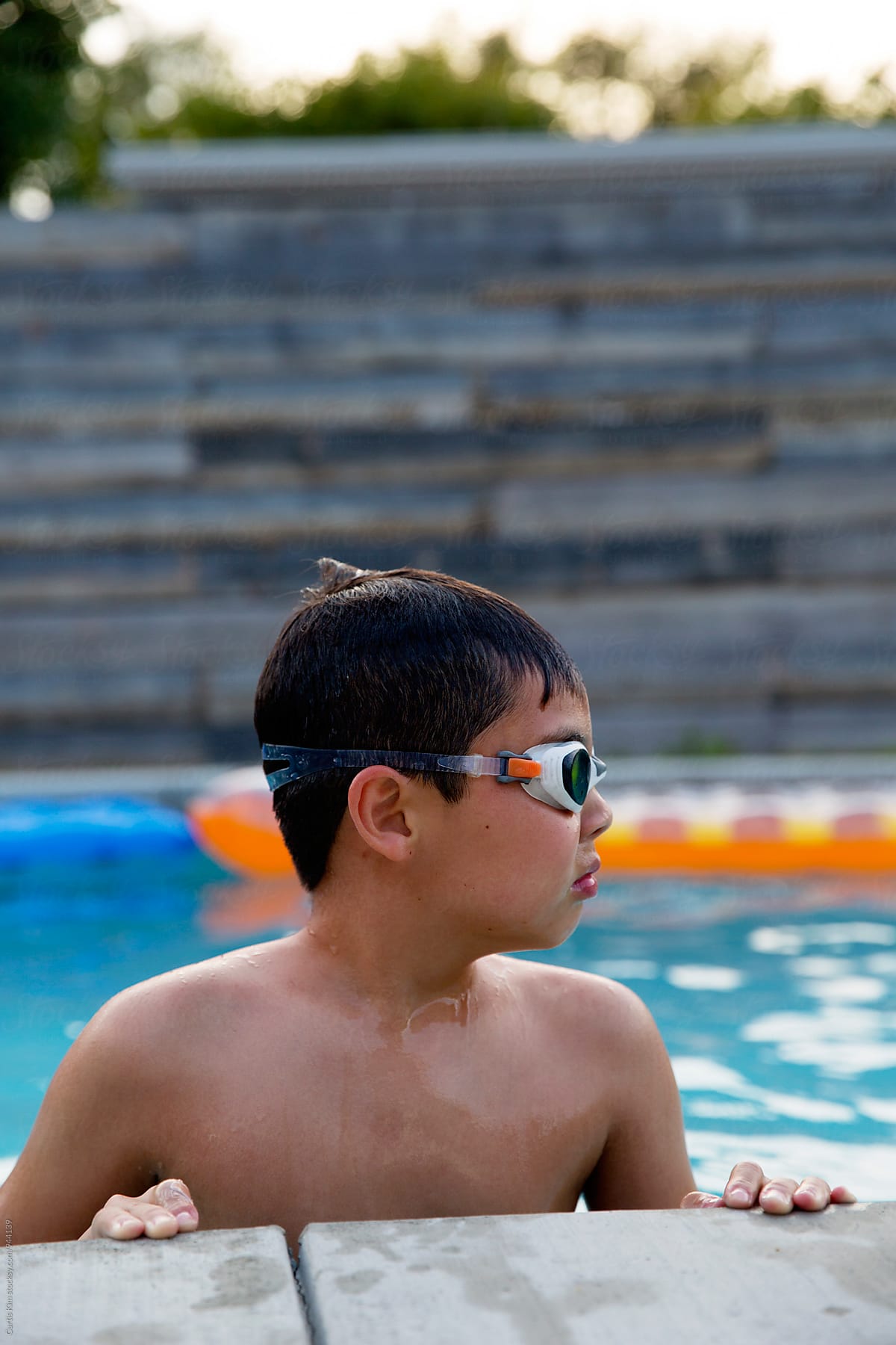 "Young Boy Looking Sideways In Pool" by Stocksy Contributor "Curtis Kim ...