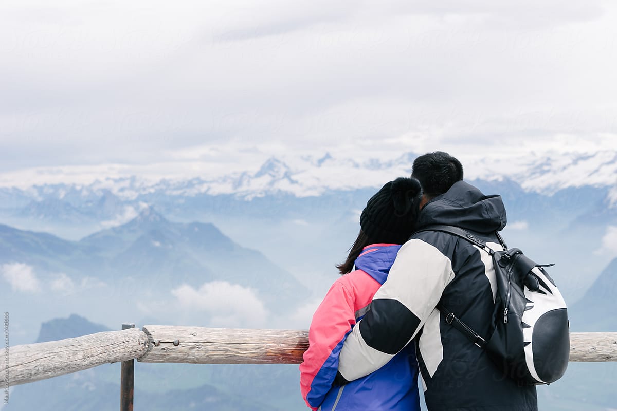 "Couple Hugging Besides Snow Mountain" by Stocksy Contributor "MaaHoo ...
