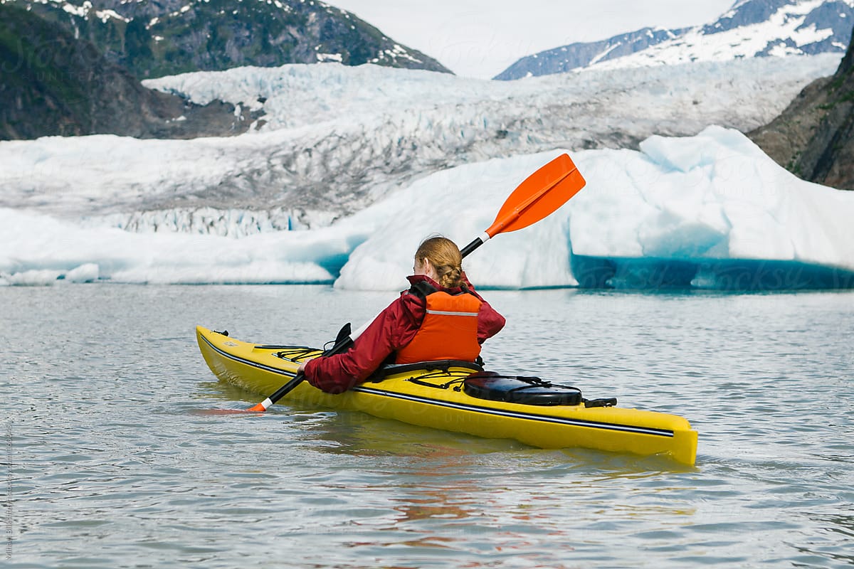 "Young Woman Paddling In A Kayak Around Mendenhall Glacier" by Stocksy ...