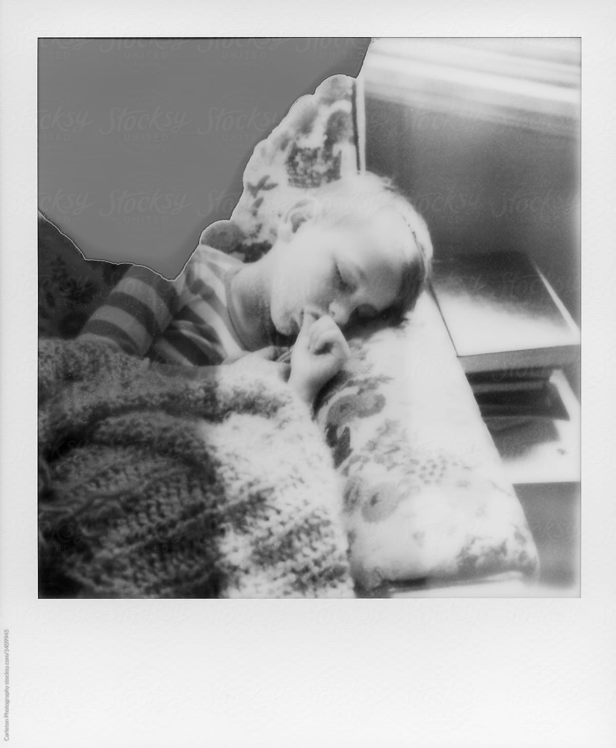 Six Year Old Boy In Striped Pajamas Sleeping In An Armchair While Six Year Old Boy In Striped Pajamas Sleeping In An Armchair While