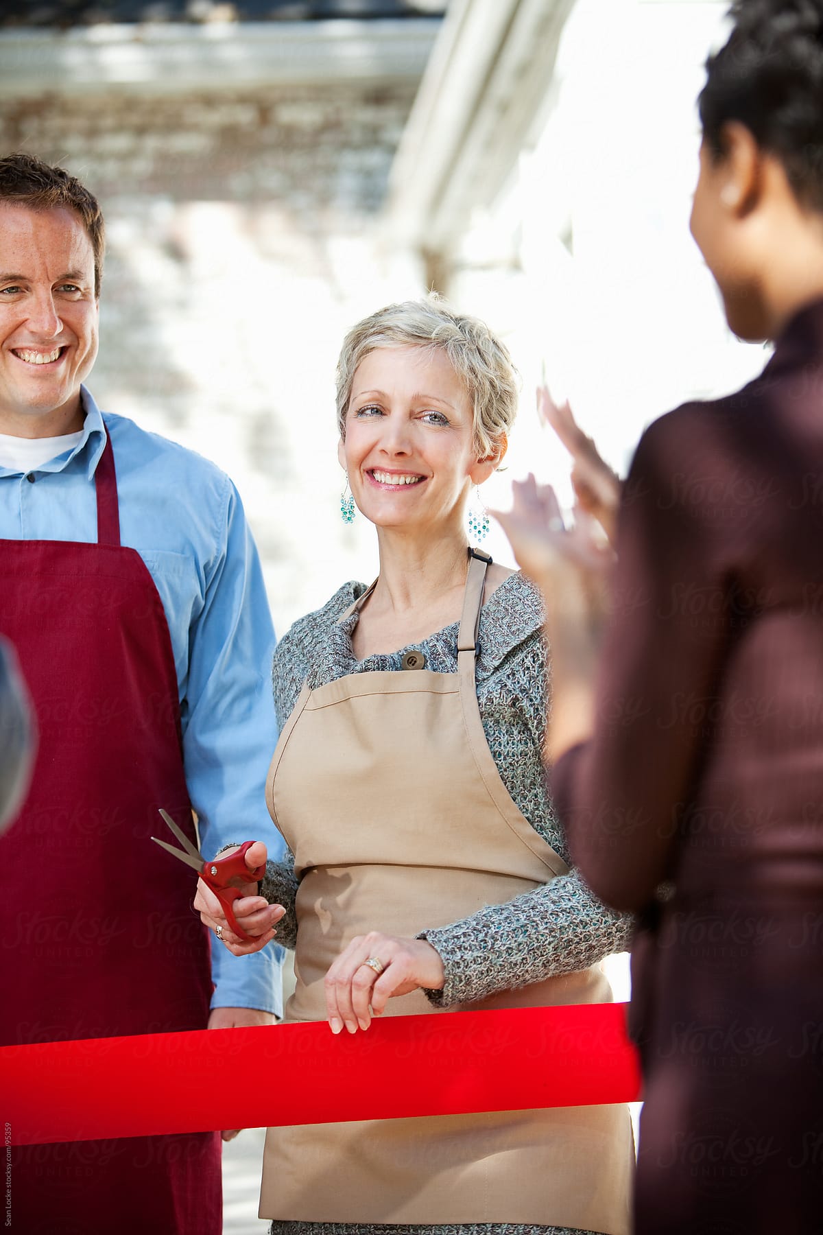 "Shop: Crowd Applauds Grand Opening" by Stocksy Contributor "Sean Locke ...