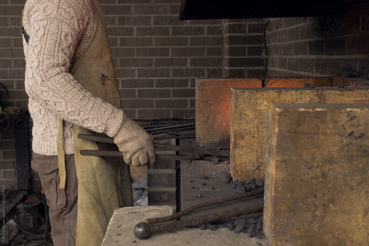 "Blacksmith Working In Anvil" by Stocksy Contributor "Danil Nevsky ...