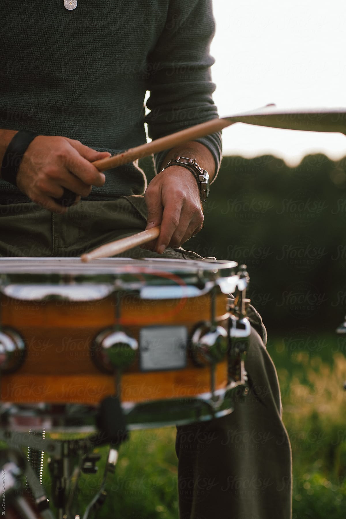"Drummer Playing In Nature" by Stocksy Contributor "Giada Canu" - Stocksy