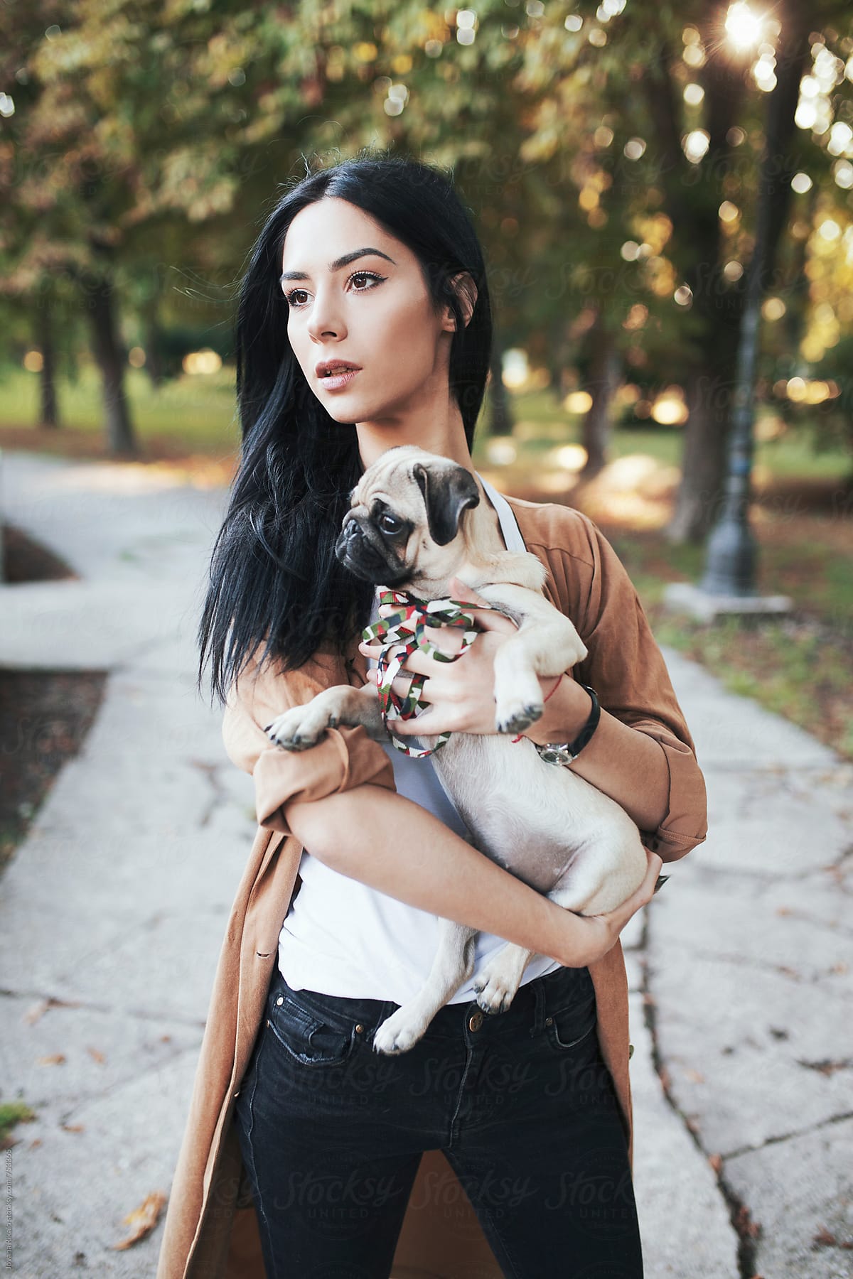 "Fashionable Young Woman And A Pug Dog" by Stocksy Contributor "Jovana ...