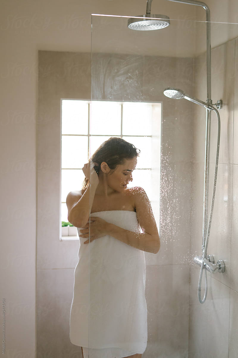 Young Woman In A Bathroom Wrapped In A White Towel After A Shower By Young Woman In A Bathroom Wrapped In A White Towel After A Shower By