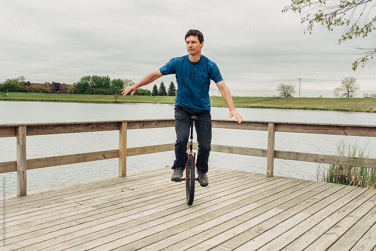 "Unicyclist Keeping His Balance" by Stocksy Contributor "Gabi Bucataru ...