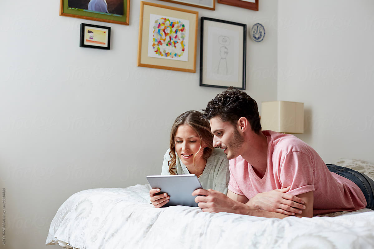"Couple Using Tablet Computer In Bed At Home" by Stocksy Contributor ...