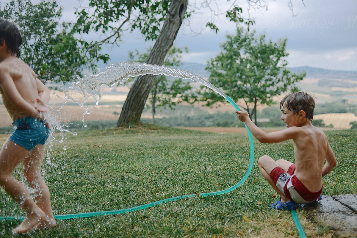 "Two Boys Having A Water Fight" by Stocksy Contributor "Kirstin Mckee ...