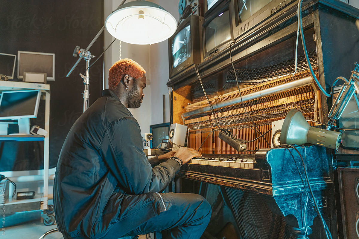 "Musician At Piano In Vintage Studio" by Stocksy Contributor "Basil ...