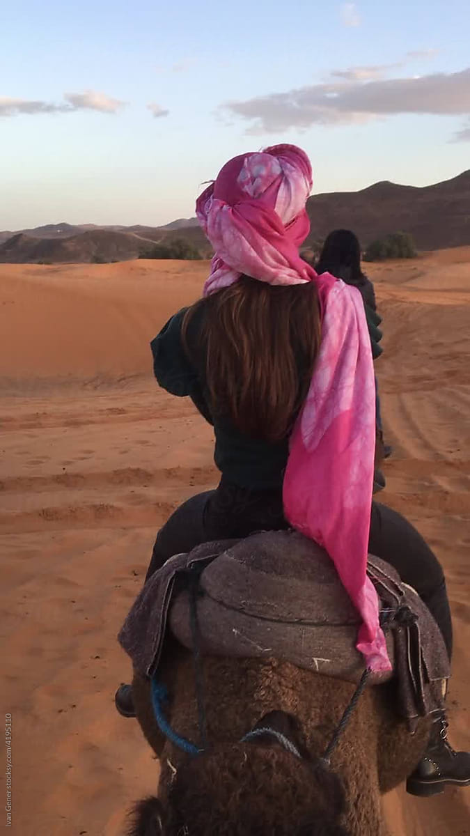 "Woman Riding A Dromedary In Desert" by Stocksy Contributor "Ivan Gener ...