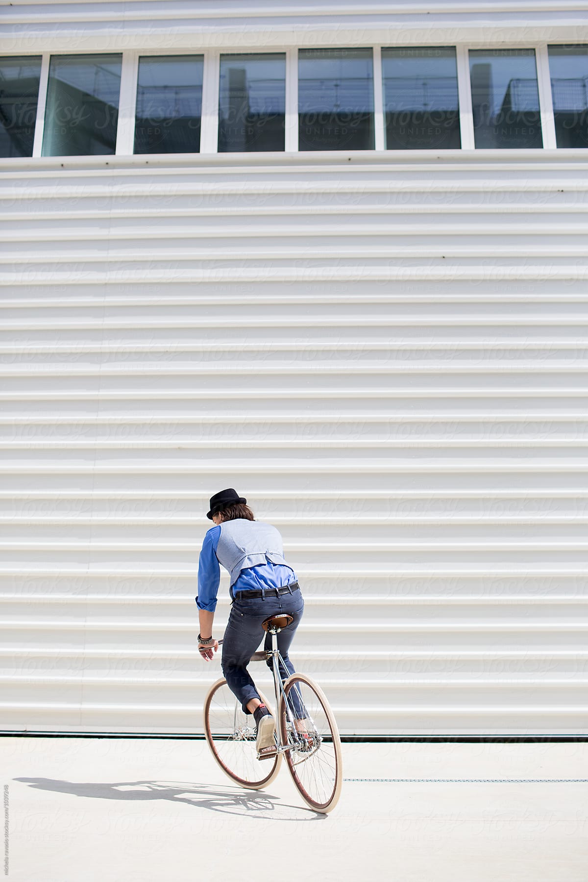 "Back View Of Young Man Cycling" by Stocksy Contributor "Michela ...