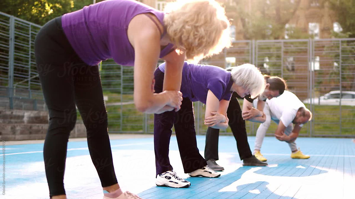 "Older People Doing Standing Forward Bend" by Stocksy Contributor ...