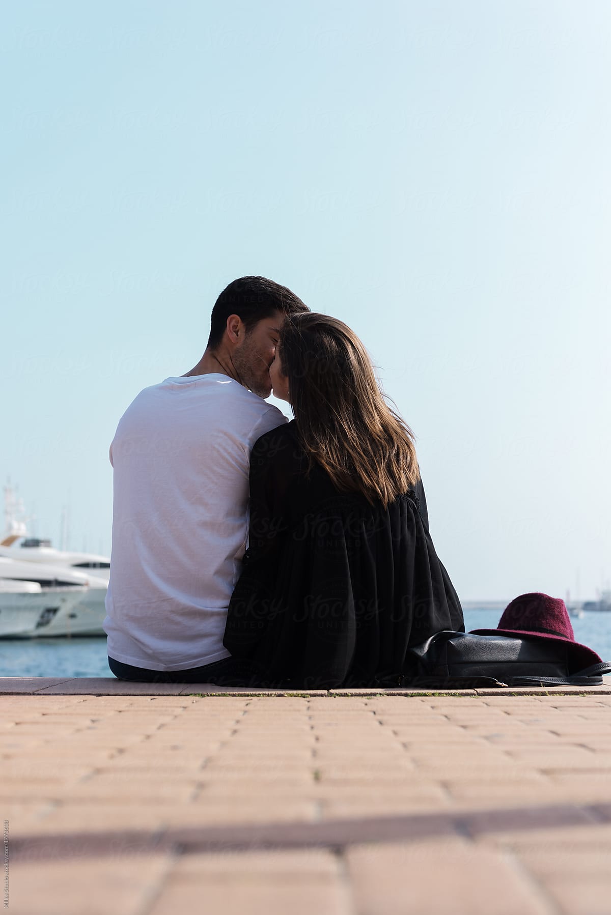 "Kissing Stylish People On Waterfront" by Stocksy Contributor "Milles ...
