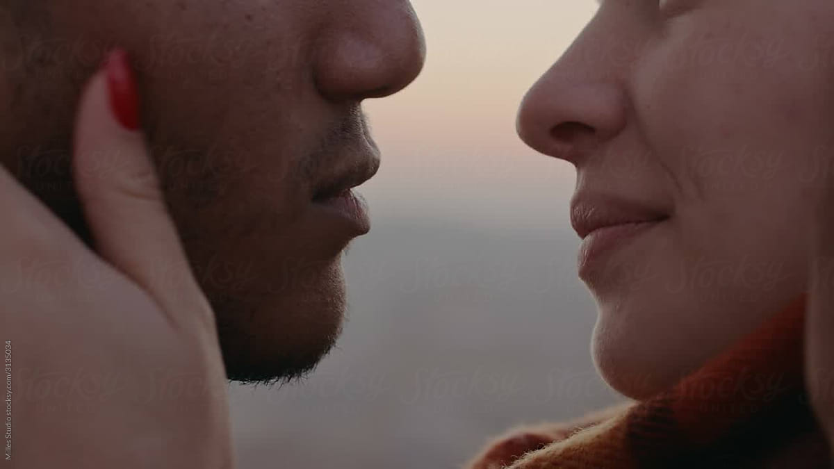 "Crop Couple Touching Faces During Date" by Stocksy Contributor "Milles ...