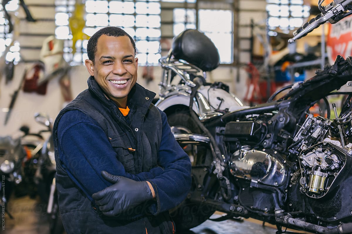 "Man Repairing A Motorbike In A Workshop" by Stocksy Contributor ...