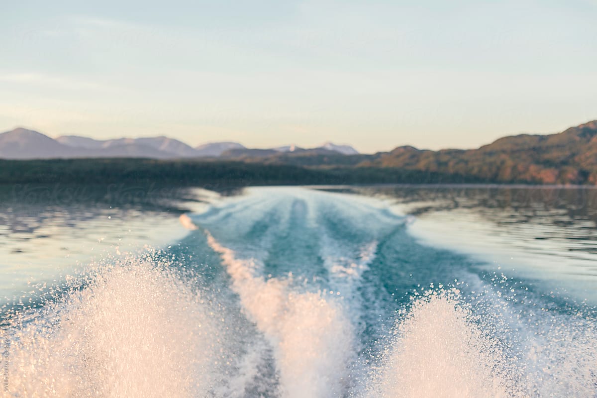 "Boat Wake On Lake" by Stocksy Contributor "Willie Dalton" - Stocksy