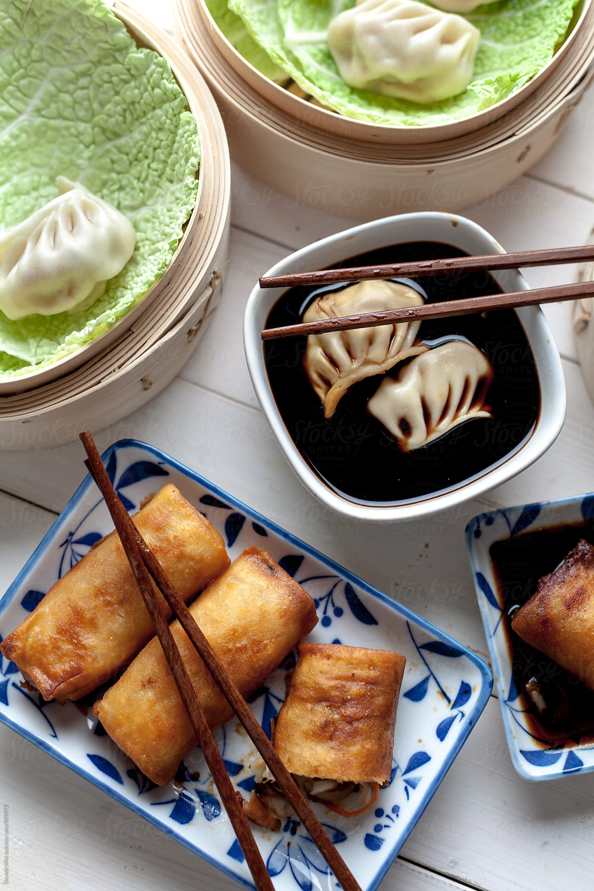 "Mixed Chinese Food" by Stocksy Contributor "Davide Illini" - Stocksy