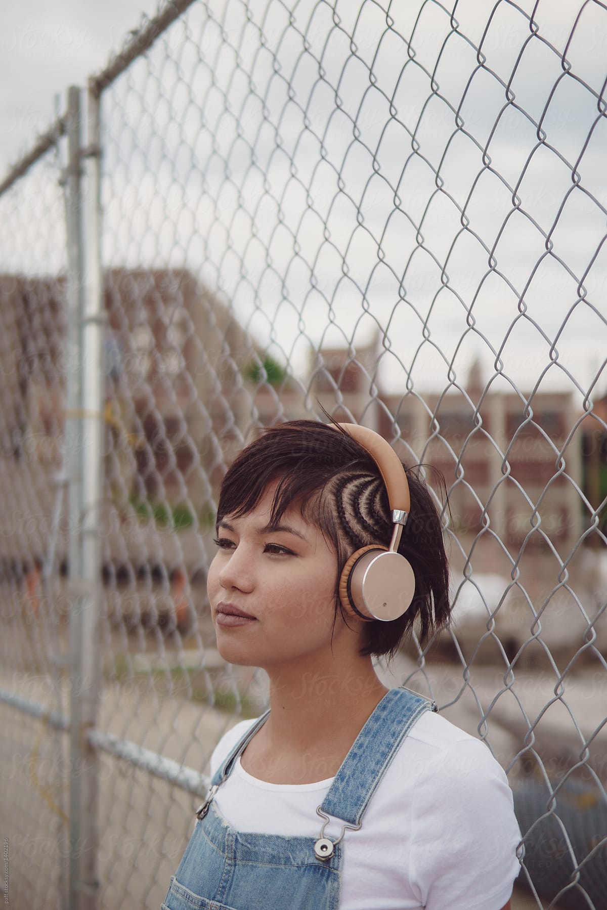 "Girl With Overalls Listening To Music" by Stocksy Contributor "Paff ...