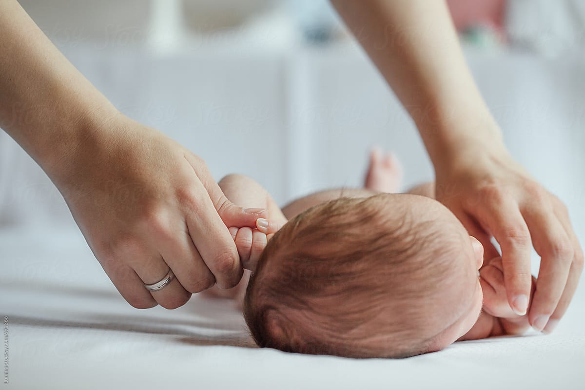 "Mother Caressing Baby Girl" by Stocksy Contributor "Lumina" - Stocksy