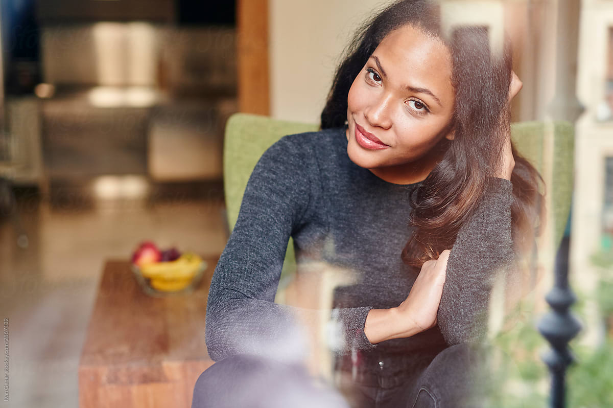 "Smiling Woman Relaxing At Home" by Stocksy Contributor "Ivan Gener ...