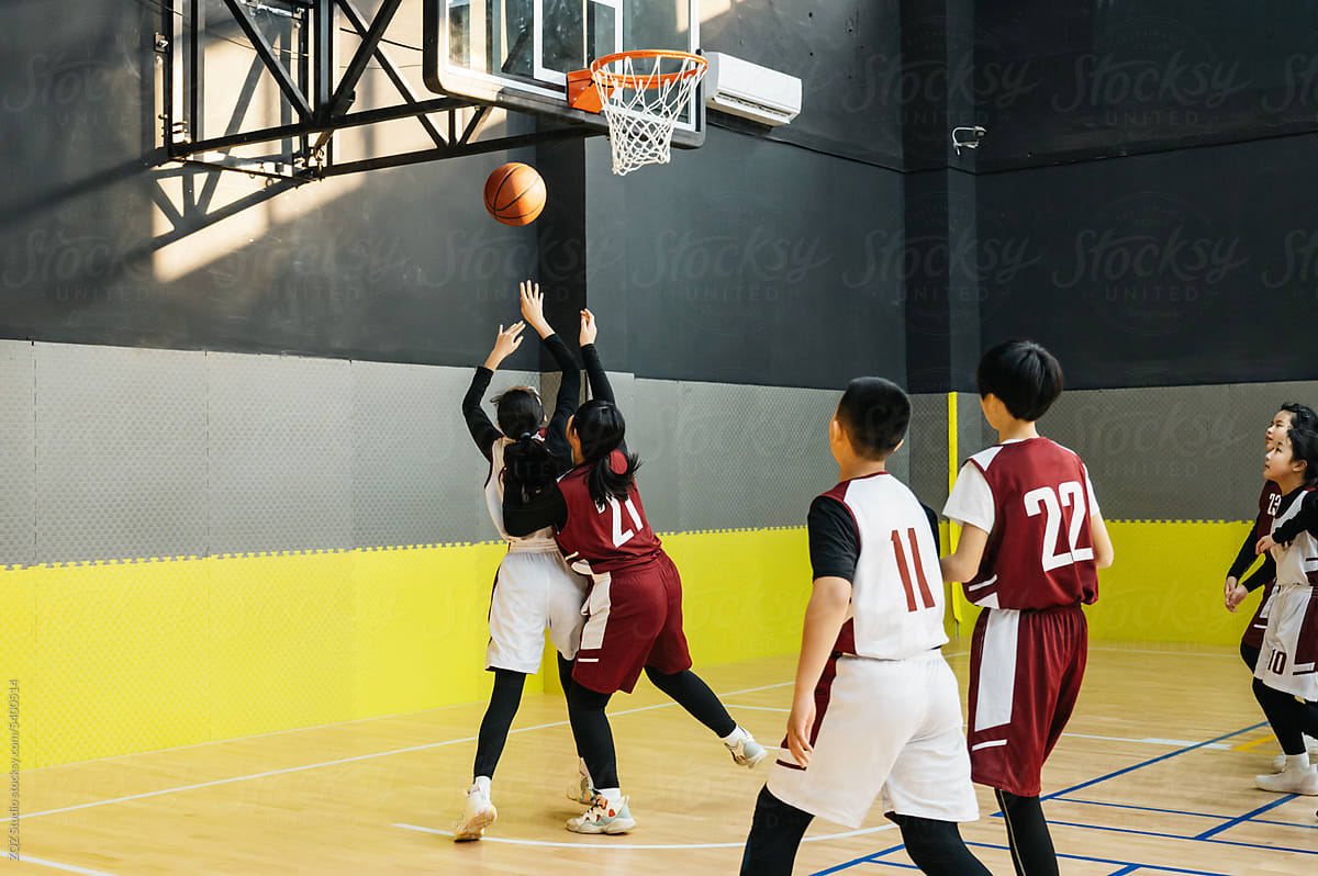 "Basketball Team Playing In Gym" by Stocksy Contributor "ZQZ Studio ...