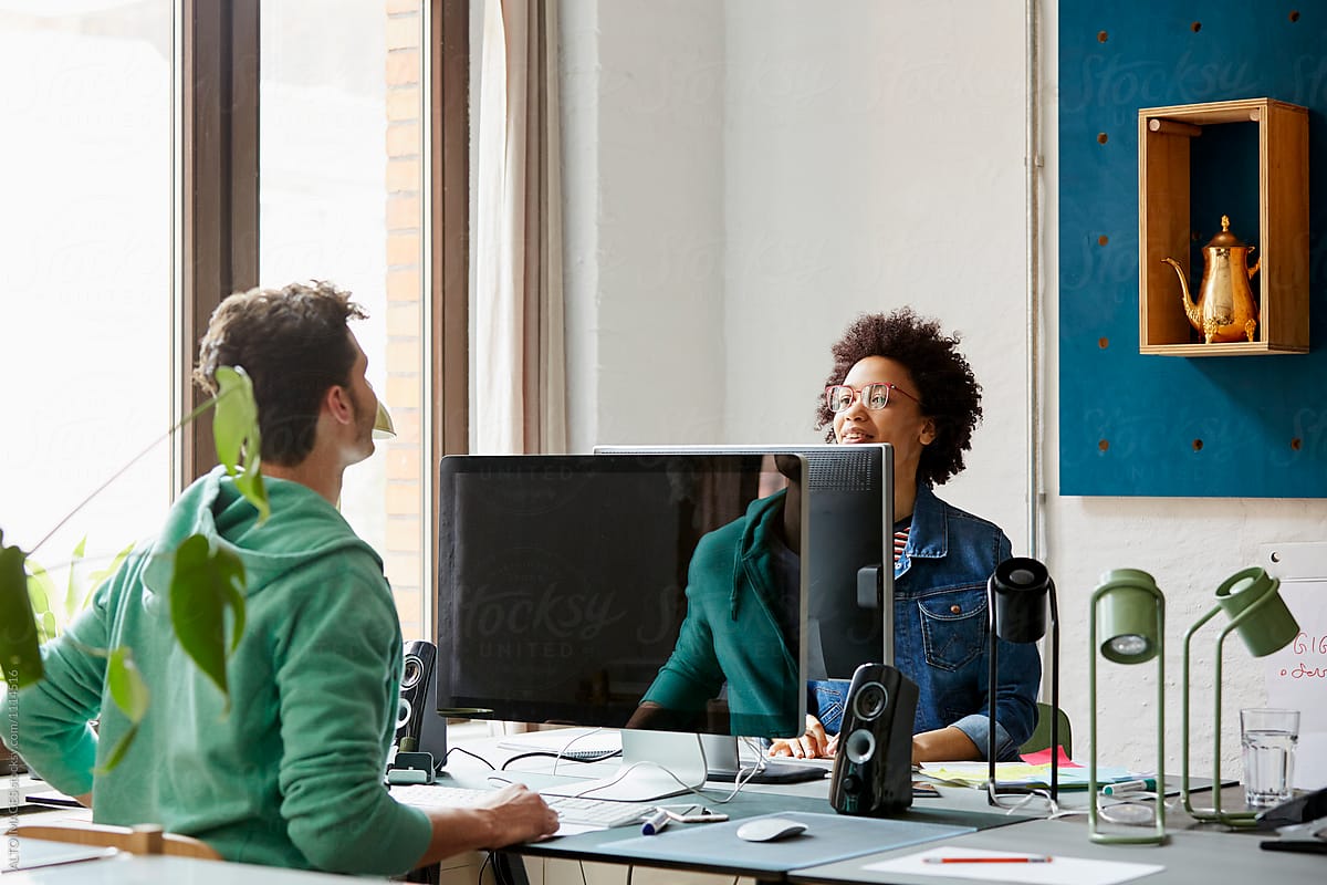 "Business People Talking At Computer Desk" by Stocksy Contributor "ALTO ...