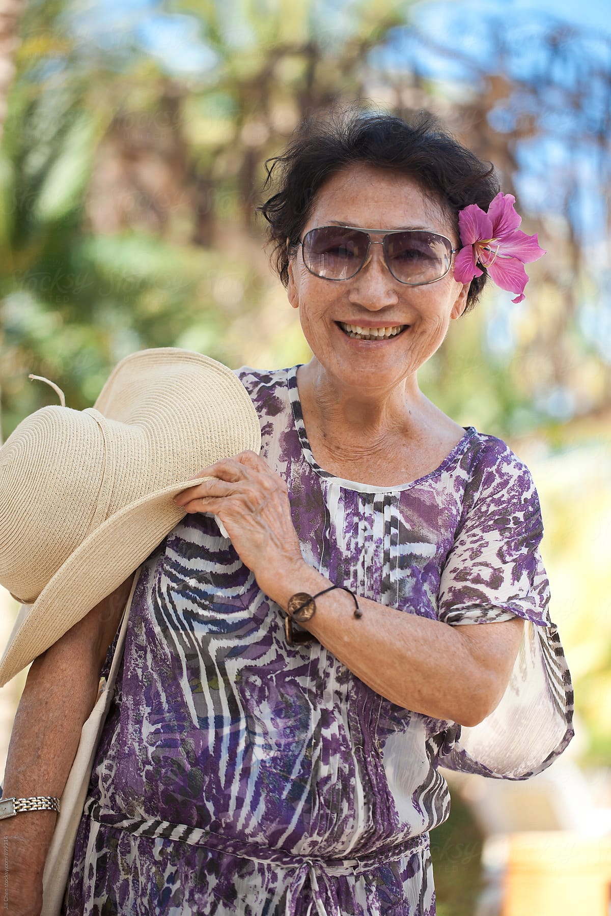"Vibrant Senior On Vacation" by Stocksy Contributor "Jill Chen" - Stocksy