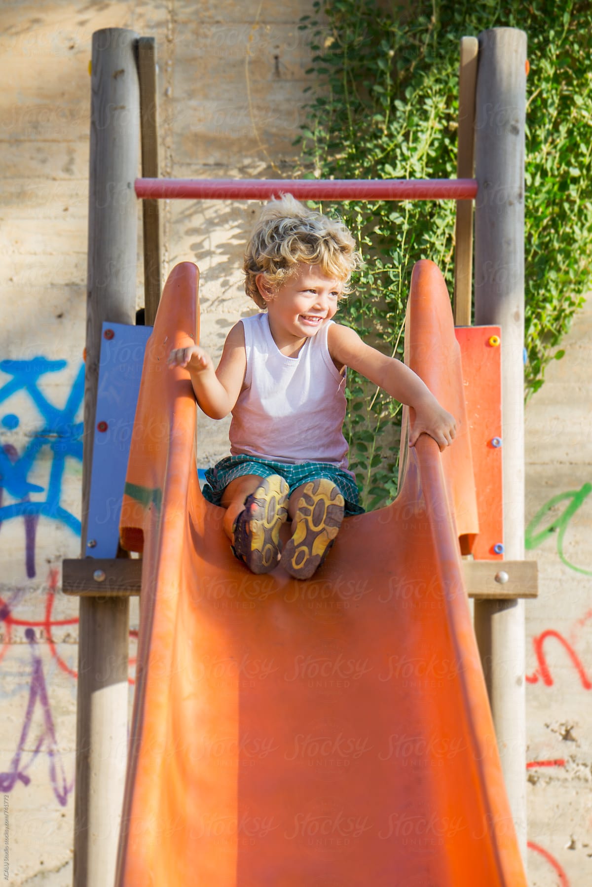 "Blond Boy In An Orange Slide" by Stocksy Contributor "ACALU Studio ...