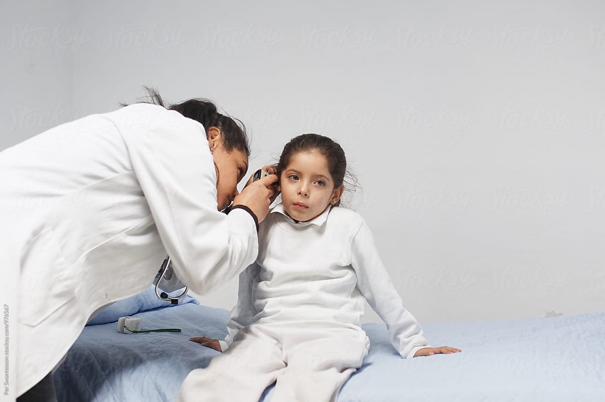"Female Doctor Check Girl's Ears" by Stocksy Contributor "PER Images ...