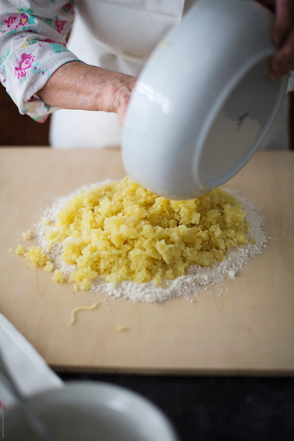 "Making Gnocchi: Woman Pouring Mashed Potatoes Into Flour" by Stocksy ...