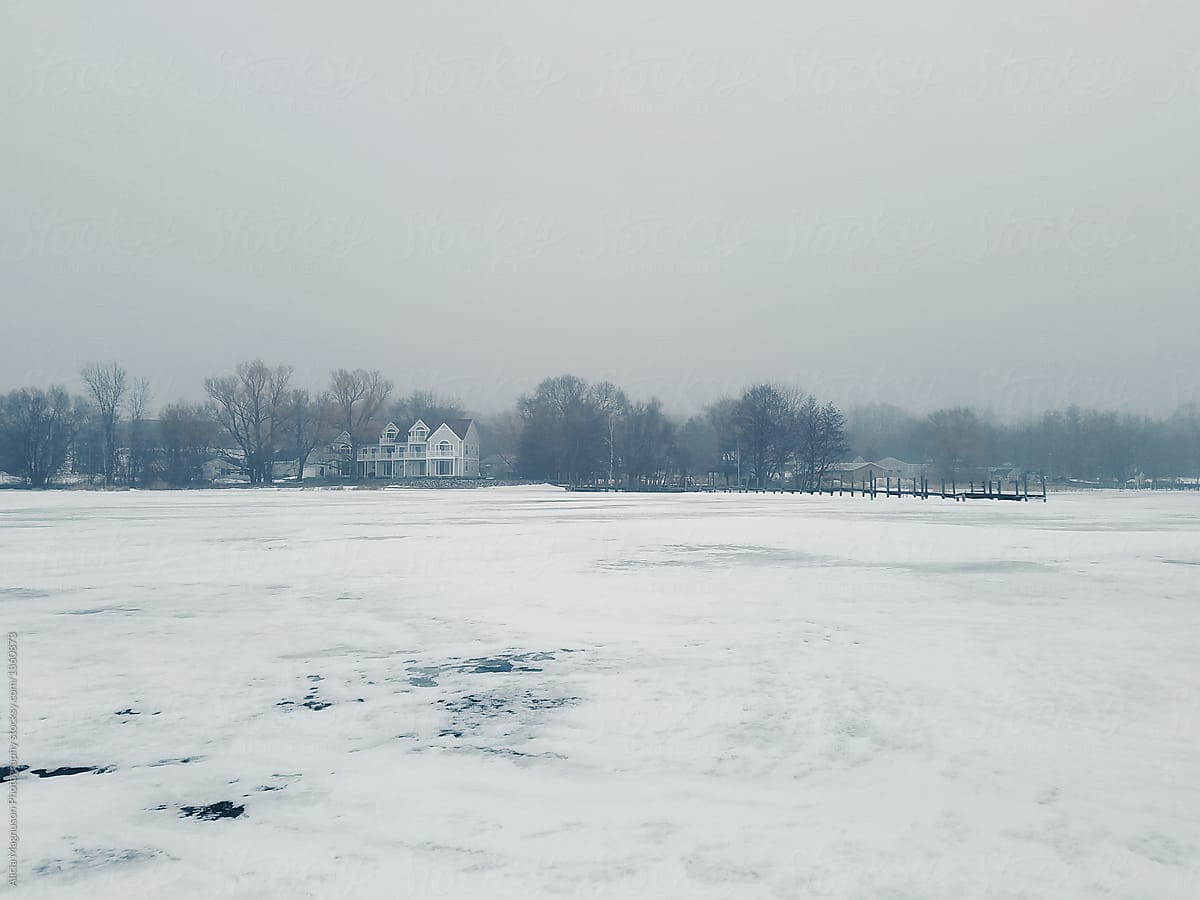 "View Of Shoreline From Middle Of Frozen Lake" by Stocksy Contributor ...