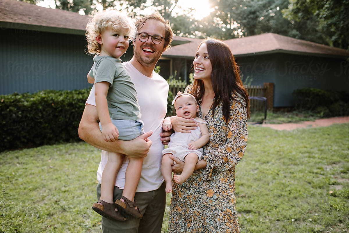 "Attractive Young Family In Front Of Their Home" by Stocksy Contributor ...