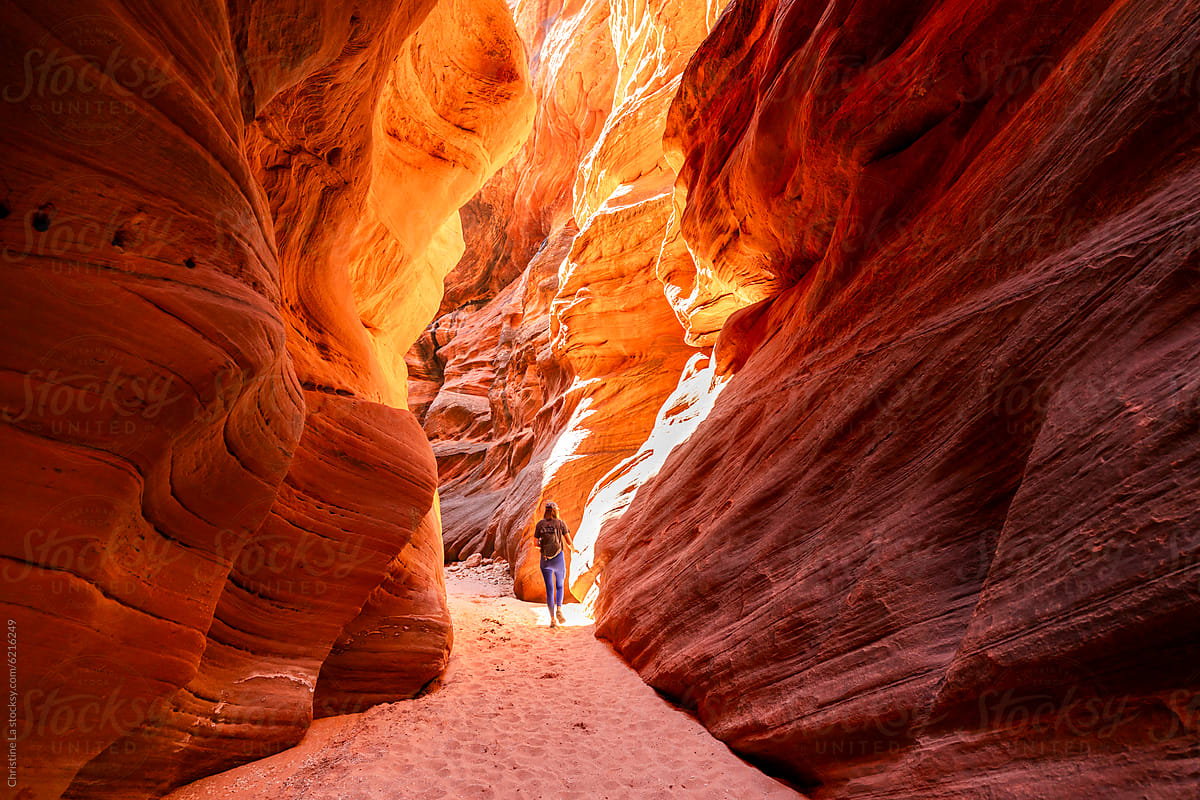 "Hiker In Narrow Canyon" by Stocksy Contributor "Christine La" - Stocksy