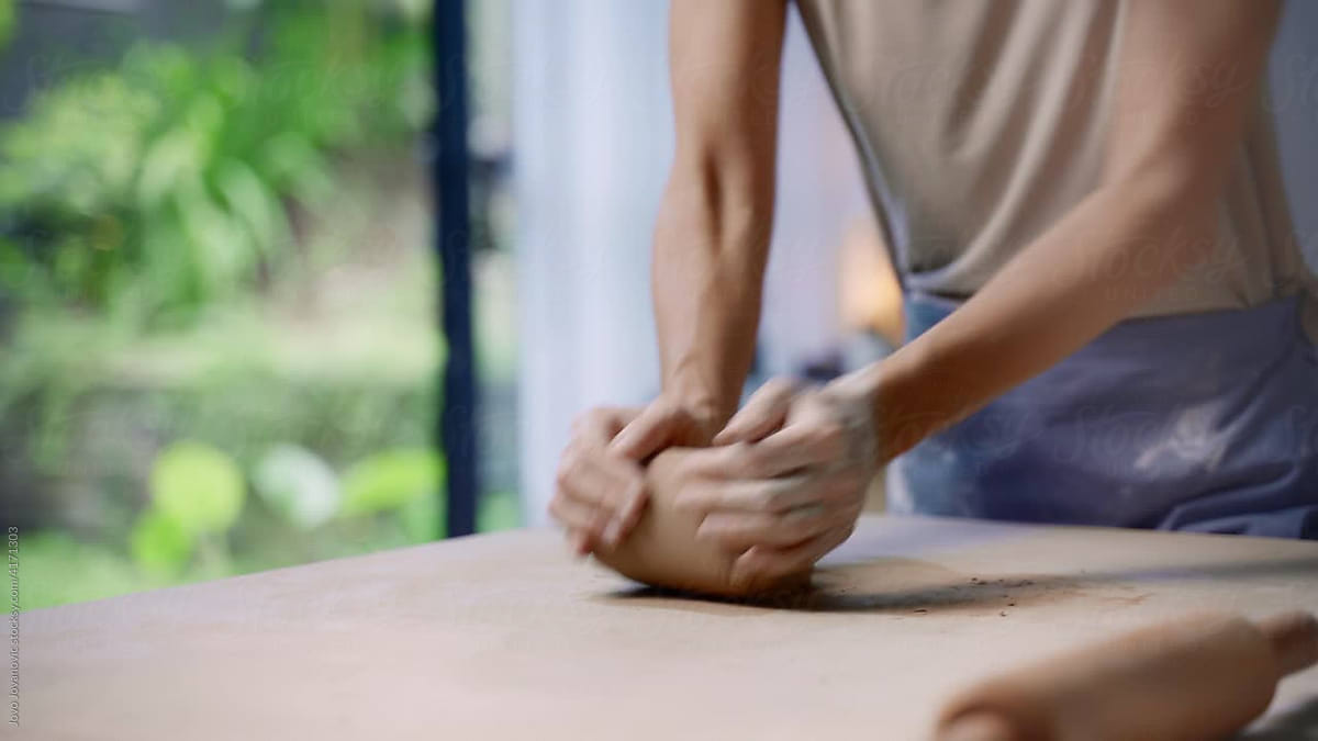 "Two Hands Kneading New Block Of Clay On Table" by Stocksy Contributor ...