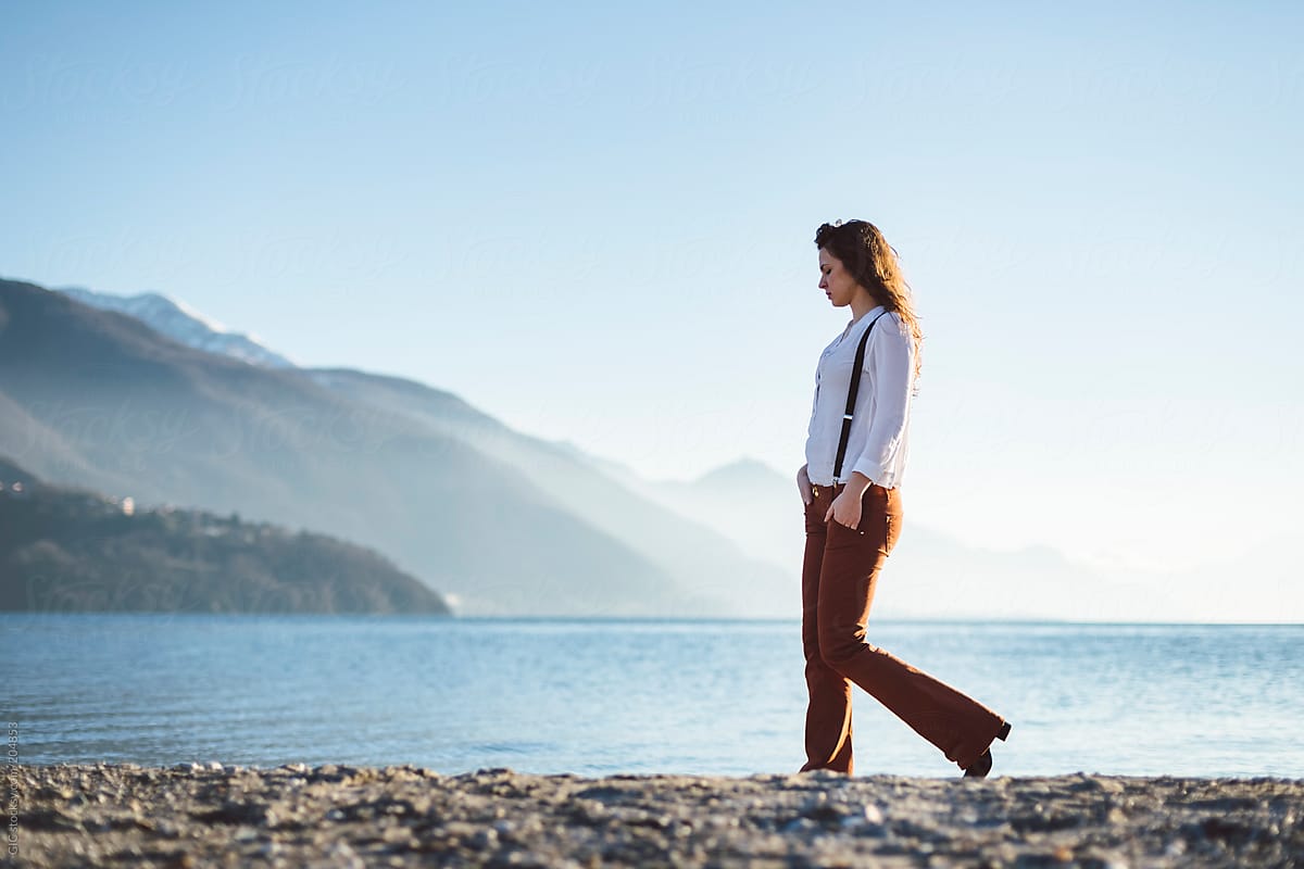 "Woman Walking At Lake" by Stocksy Contributor "koganami studio" - Stocksy