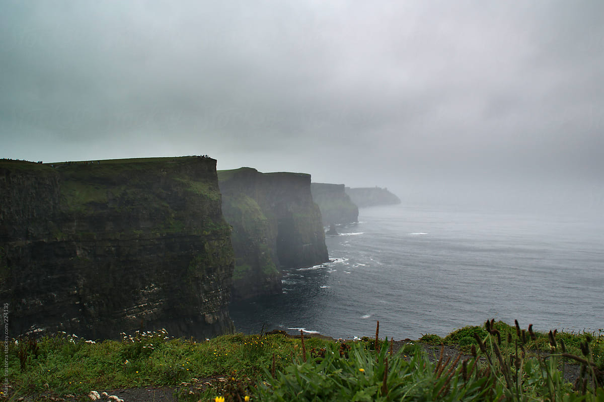 "Cliffs Of Moher With A Dramatic Sky On A Rainy And Windy Day" by ...