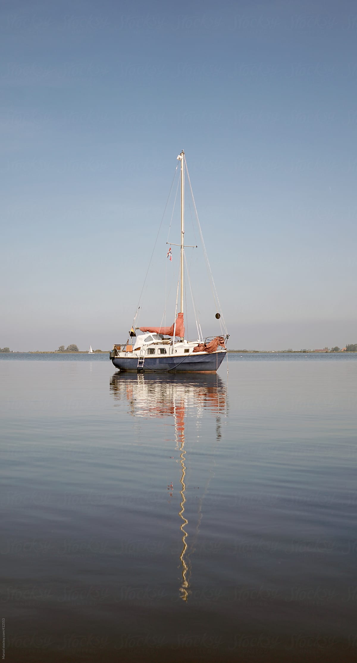 "Sailing Boat In A Dutch Lake" by Stocksy Contributor "Marcel" - Stocksy