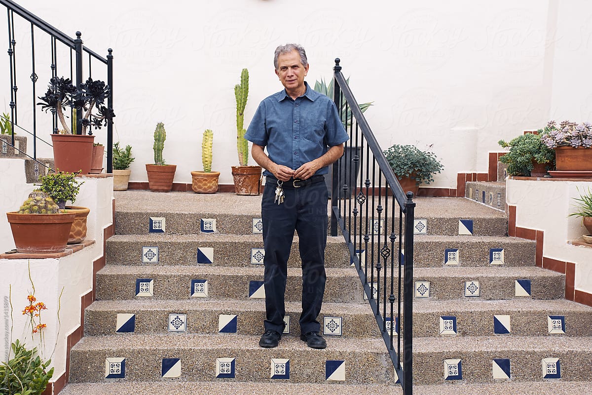 "Portrait Of Friendly Real Estate Agent At Colonial Building" by ...
