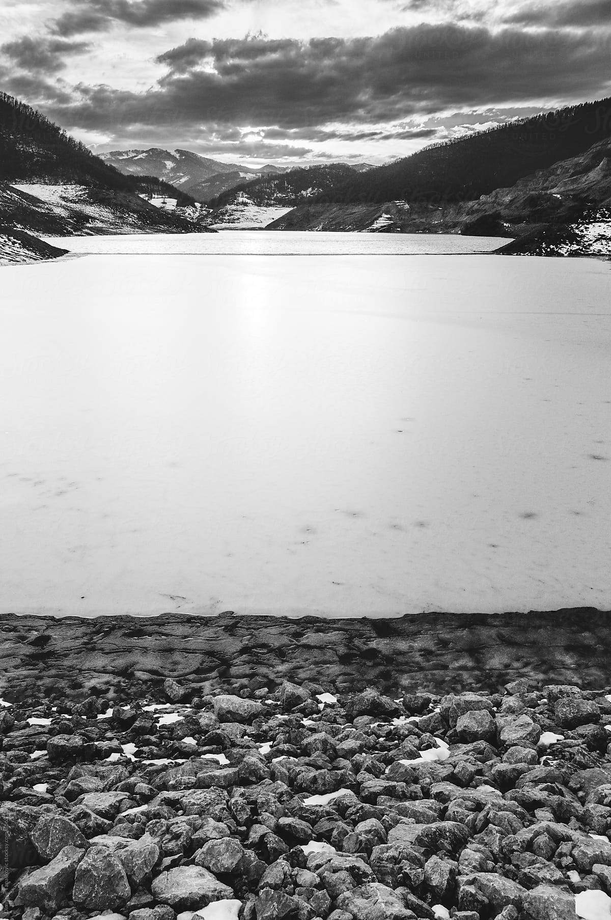 "Partially Frozen Lake Surface" by Stocksy Contributor "Dimitrije ...