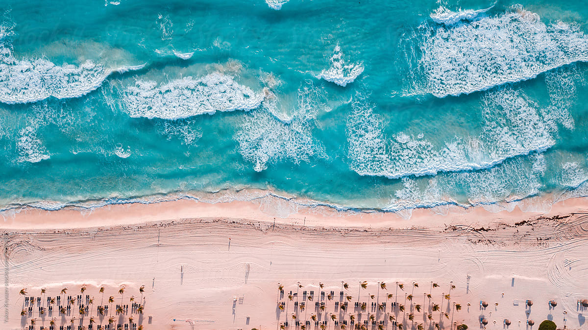 "Aerial View Of Beachfront With Waves And Palm Umbrellas" by Stocksy ...