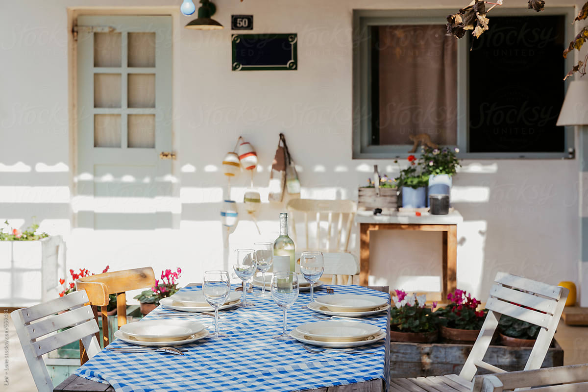 "Set Lunch Table For Five With White Wine Outdoors" by Stocksy ...