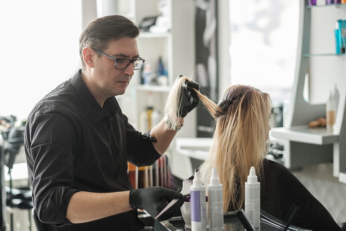 "Hairdresser Working With Anonymous Female Customer" by Stocksy ...
