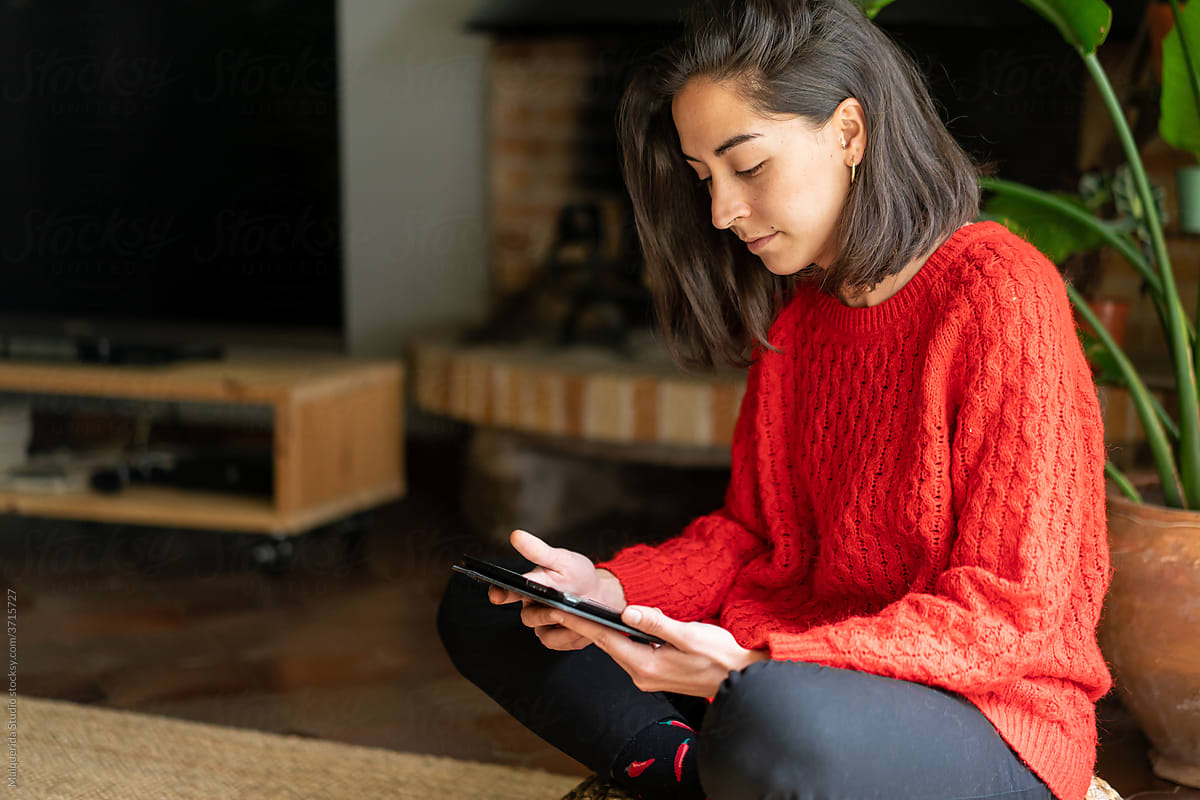 "Young Woman At Home Browsing A Computer Tablet." by Stocksy ...
