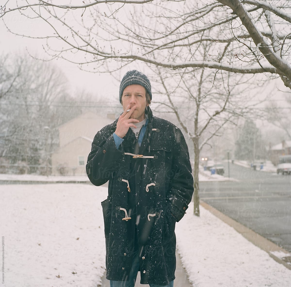 "Man Outdoors Smoking" by Stocksy Contributor "CWP, LLC" - Stocksy