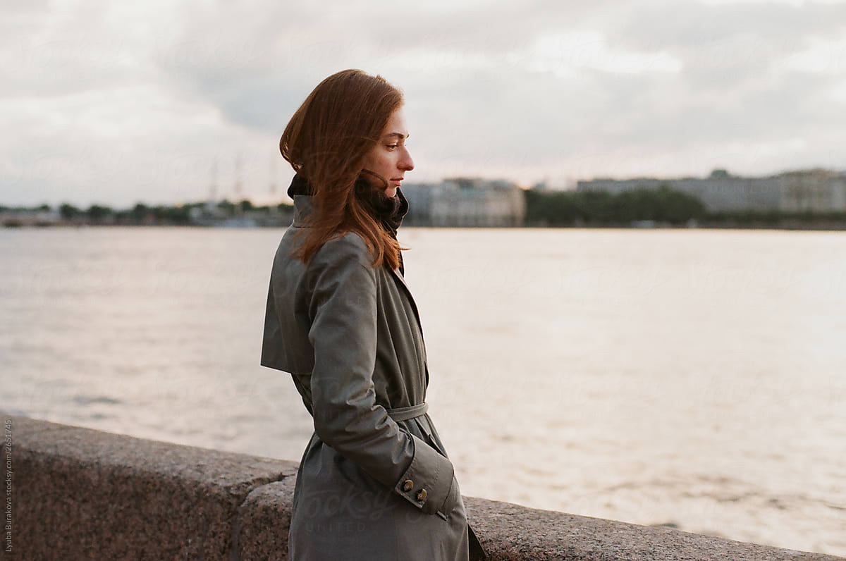 "Woman Enjoys River View" by Stocksy Contributor "Amor Burakova" - Stocksy