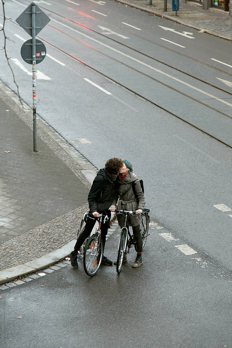 "Couple With Bicycles Kissing On Road" by Stocksy Contributor "Danil ...
